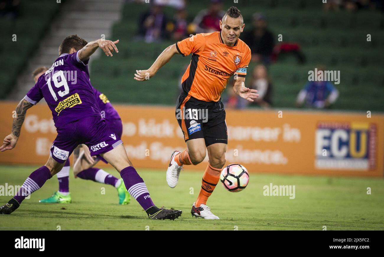 Josh Risdon of the Perth Glory and Jade North of the Brisbane Roar ...