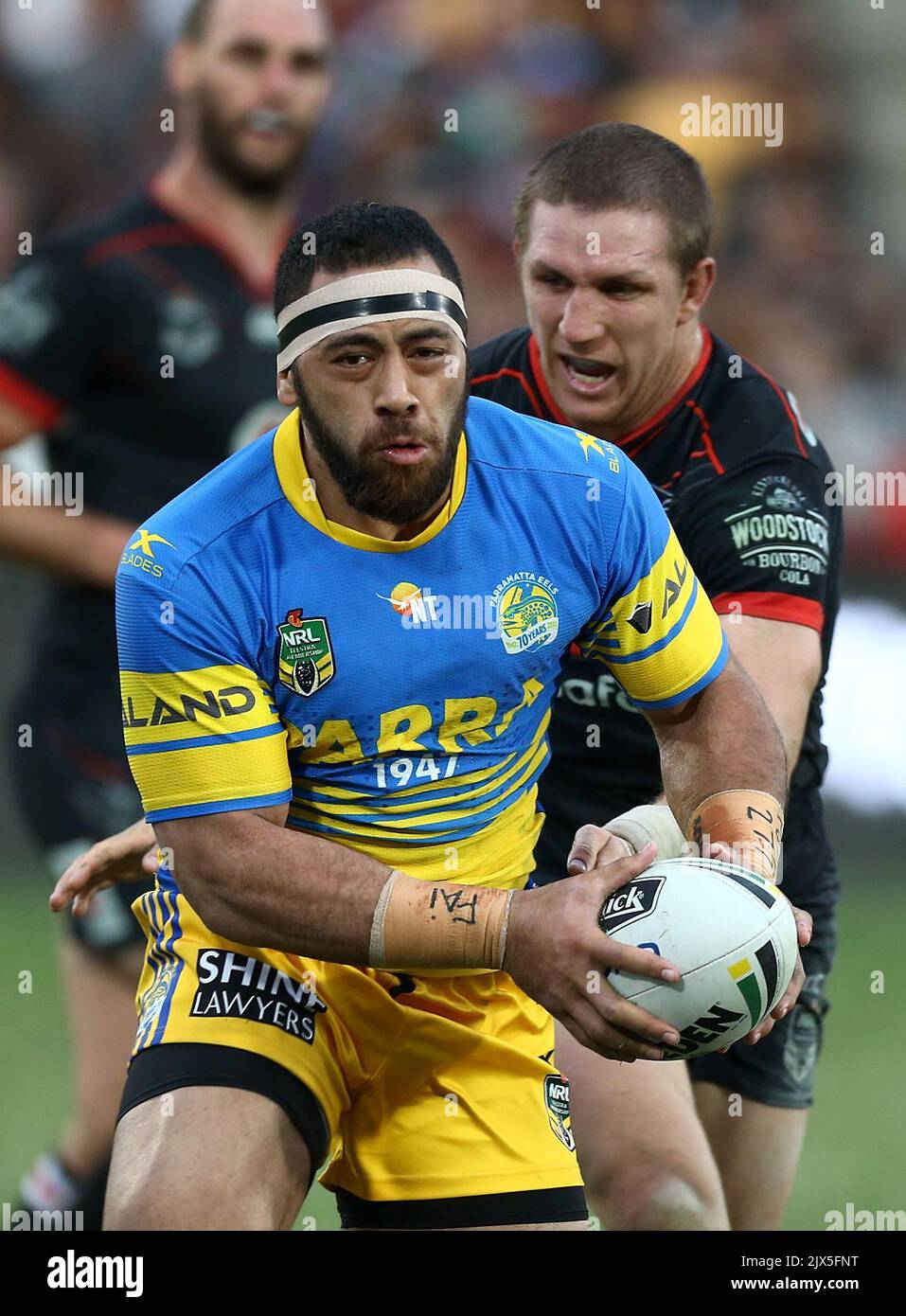 Suaia Matagi of the Eels is chased by Ryan Hoffman of the Warriors ...