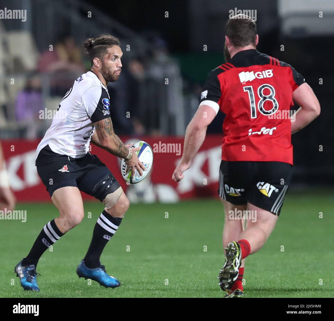 Derek Carpenter of the Sunwolves, left, makes a run in the Super Rugby ...