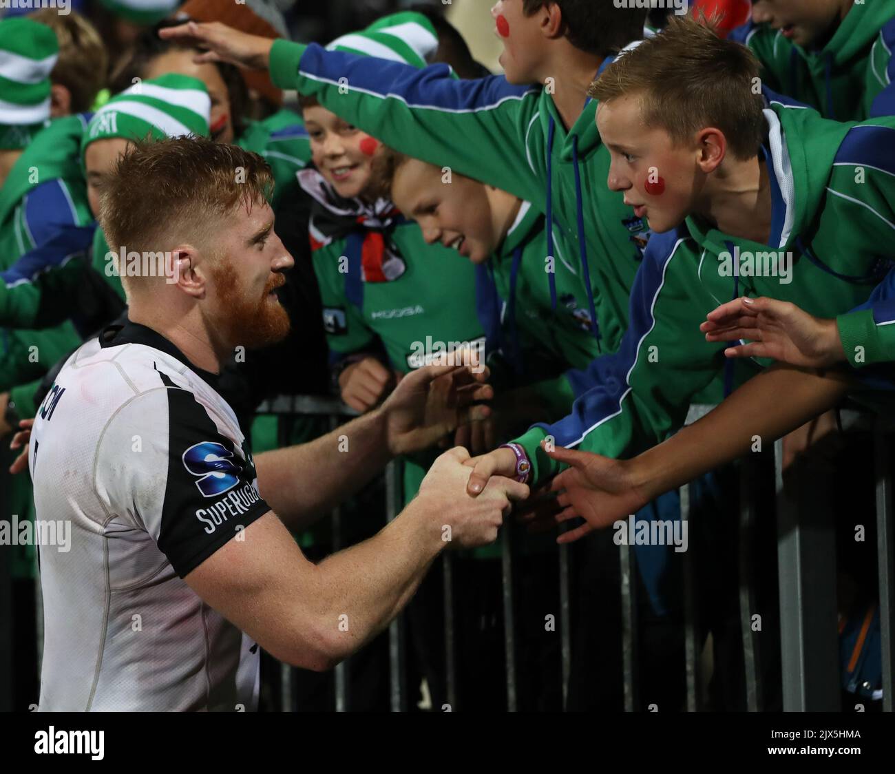 Edward Quirk of the Sunwolves meets fans at the end of the game in the ...