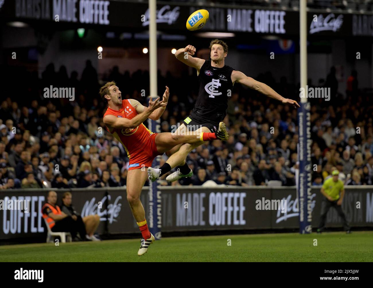 Michael Barlow of the Suns and Sam Rowe of the Blues contest during the ...