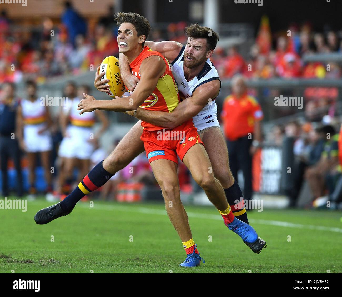 Suns player Sean Lemmens (left) competes with Crows player Andy Otten ...