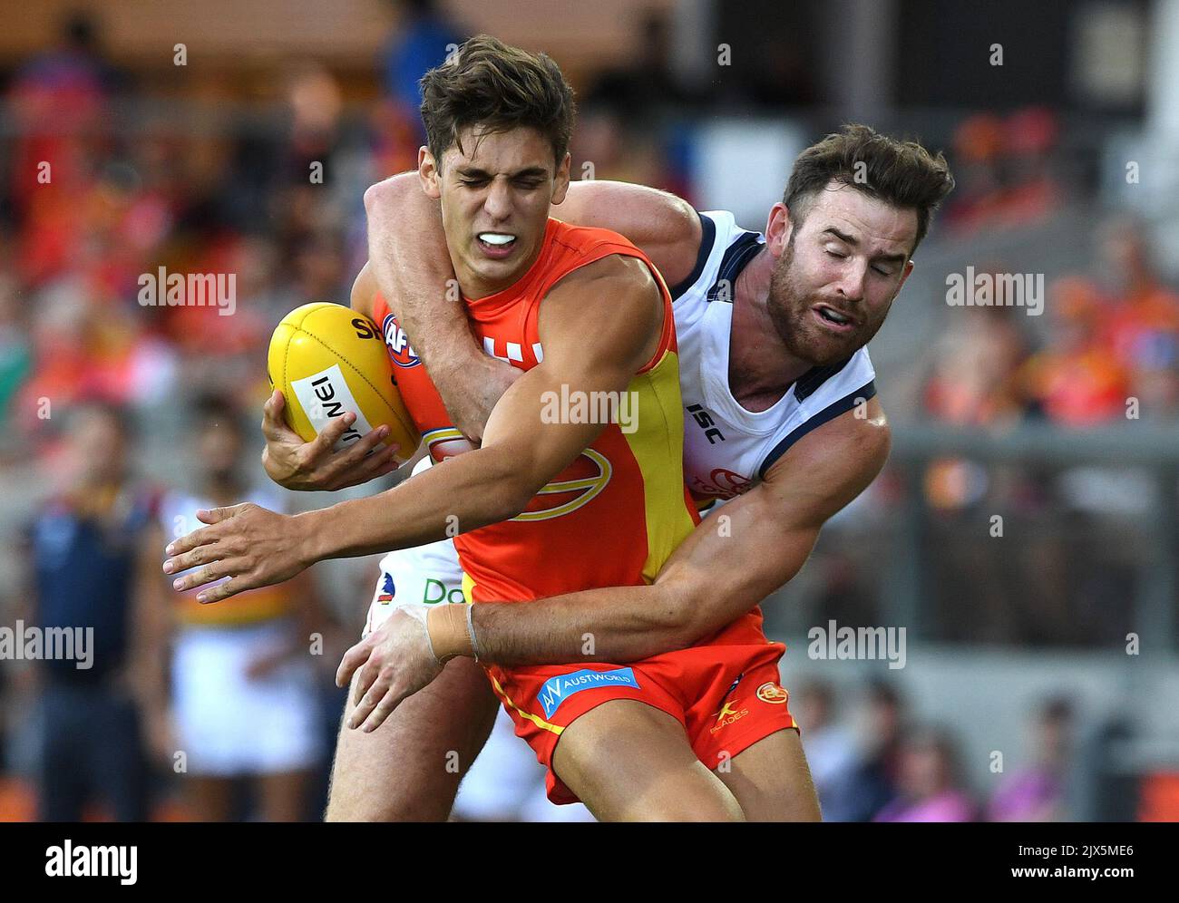 Suns player Sean Lemmens (left) competes with Crows player Andy Otten ...