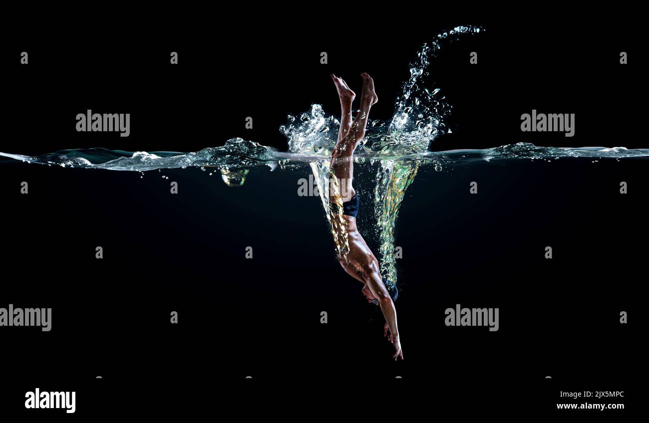 Professional man swimmer on a wave Stock Photo - Alamy