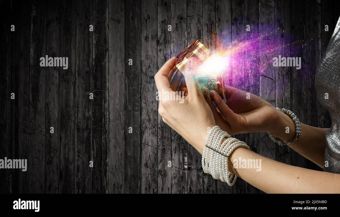 Closeup hands giving surprise gift box Stock Photo - Alamy