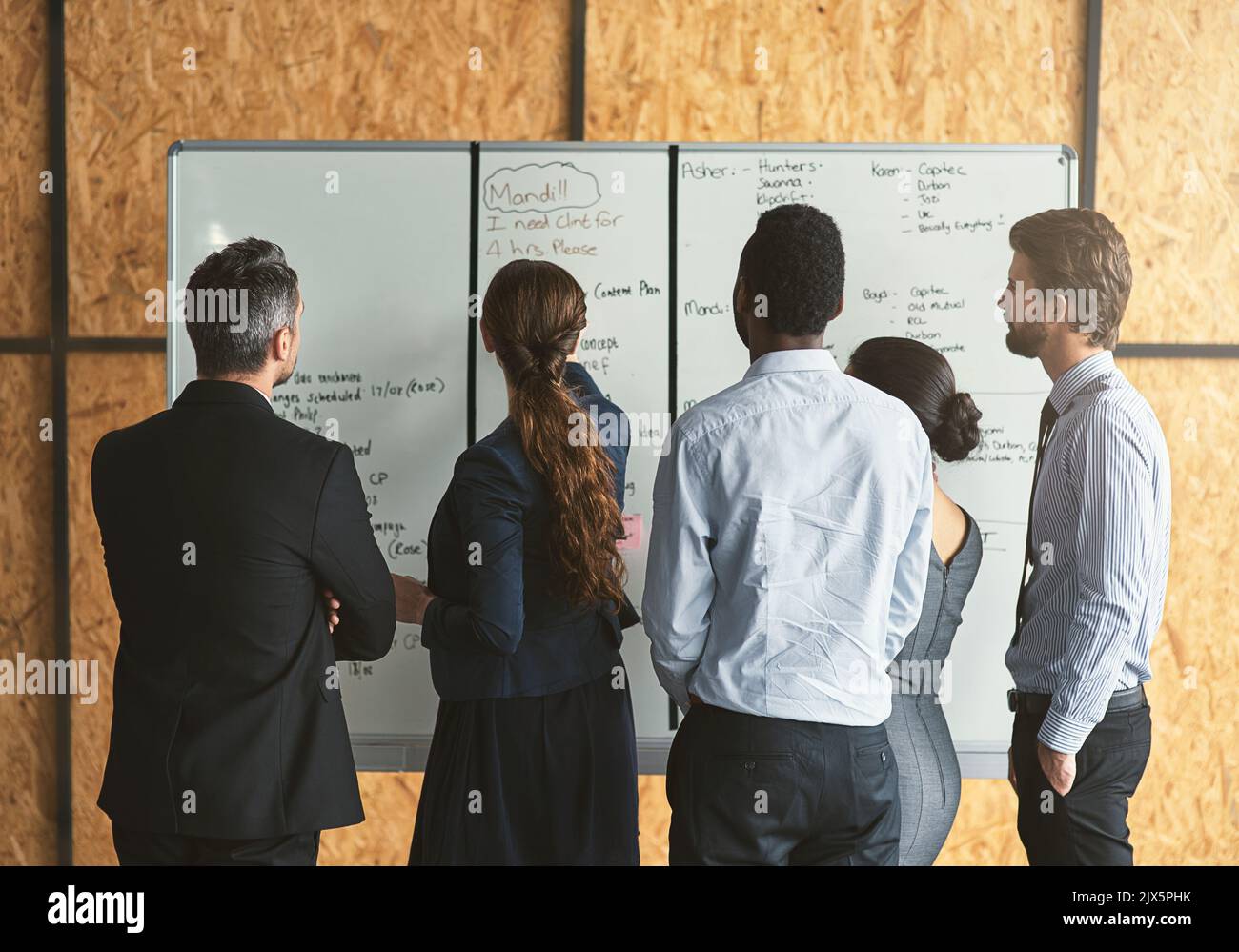 Work group brainstorming on whiteboard hi-res stock photography and ...