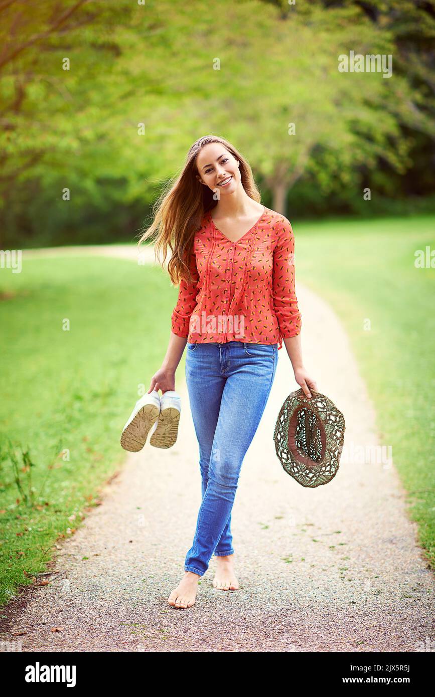 Female walking barefoot in grass hi-res stock photography and images ...