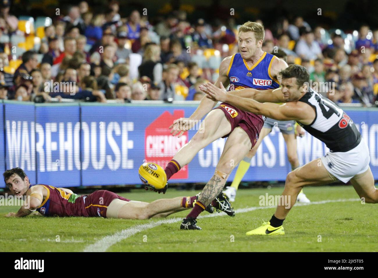 Brendon Ah Chee(right) of the Power attempts to smother the kick of ...
