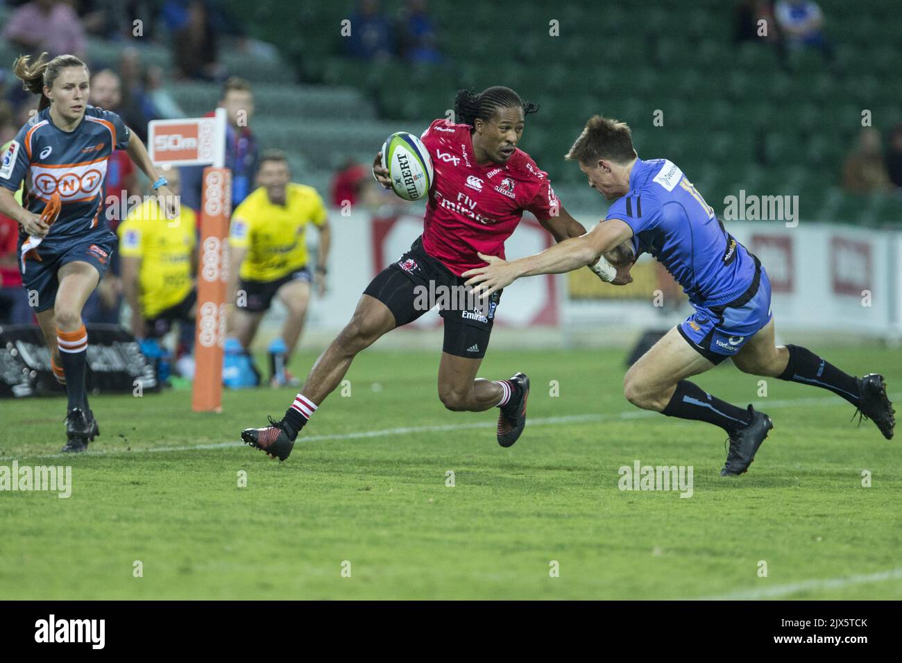 Sylvian Mahuza of the Lions takes on Alex Newsome of the Force during ...