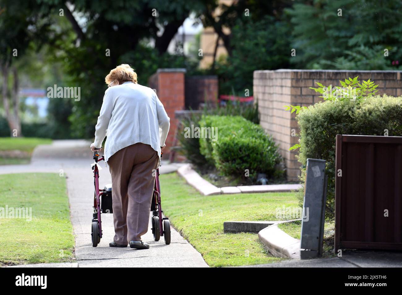 An elderly woman uses a mobility walker in Sydney on Sunday, April 30 ...