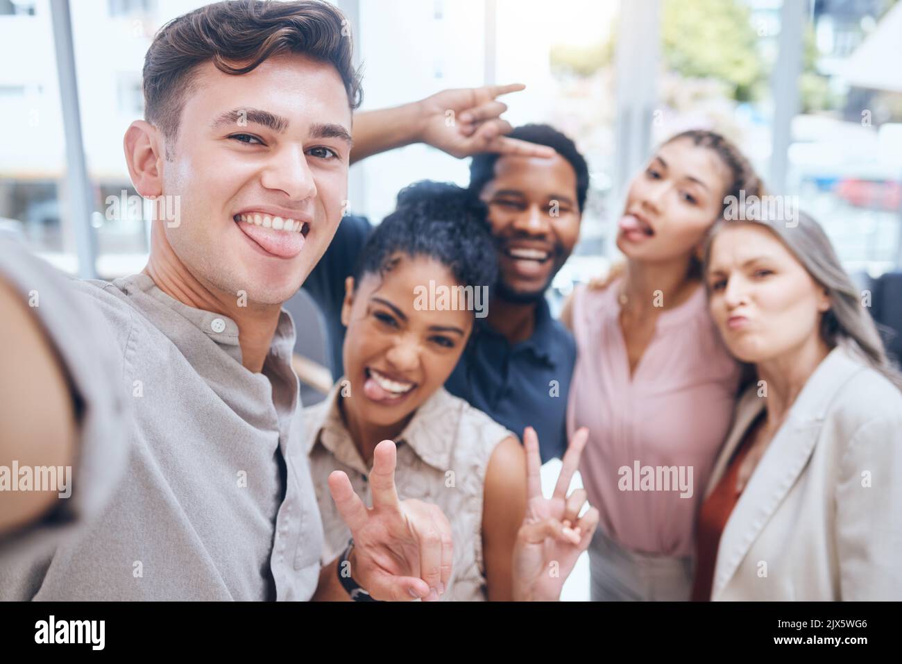Selfie, peace and teamwork with a team of business people working in collaboration and taking a ...