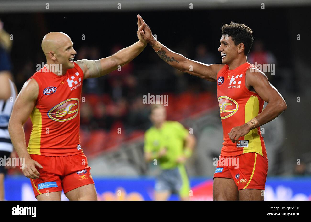 Suns player Callum Ah Chee (right) celebrates with Gary Ablett after ...