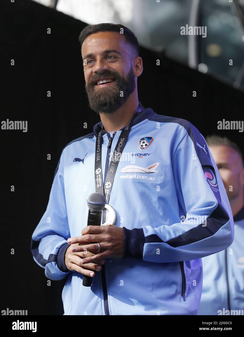 Sydney FC's Alex Brusque speaks to the crowd during team celebrations ...
