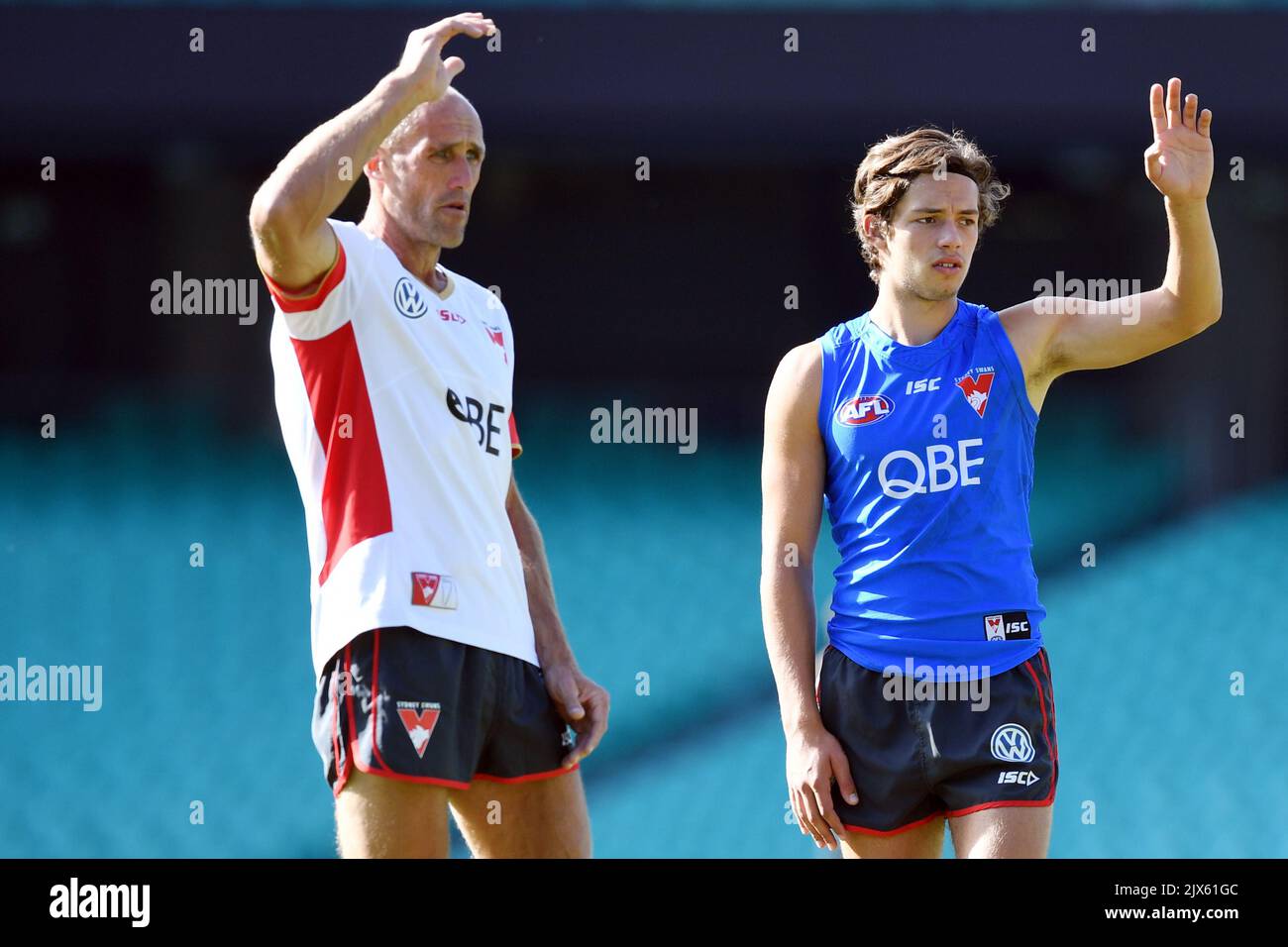 Sydney Swans AFL player Oliver Florent (right) talks with former player ...