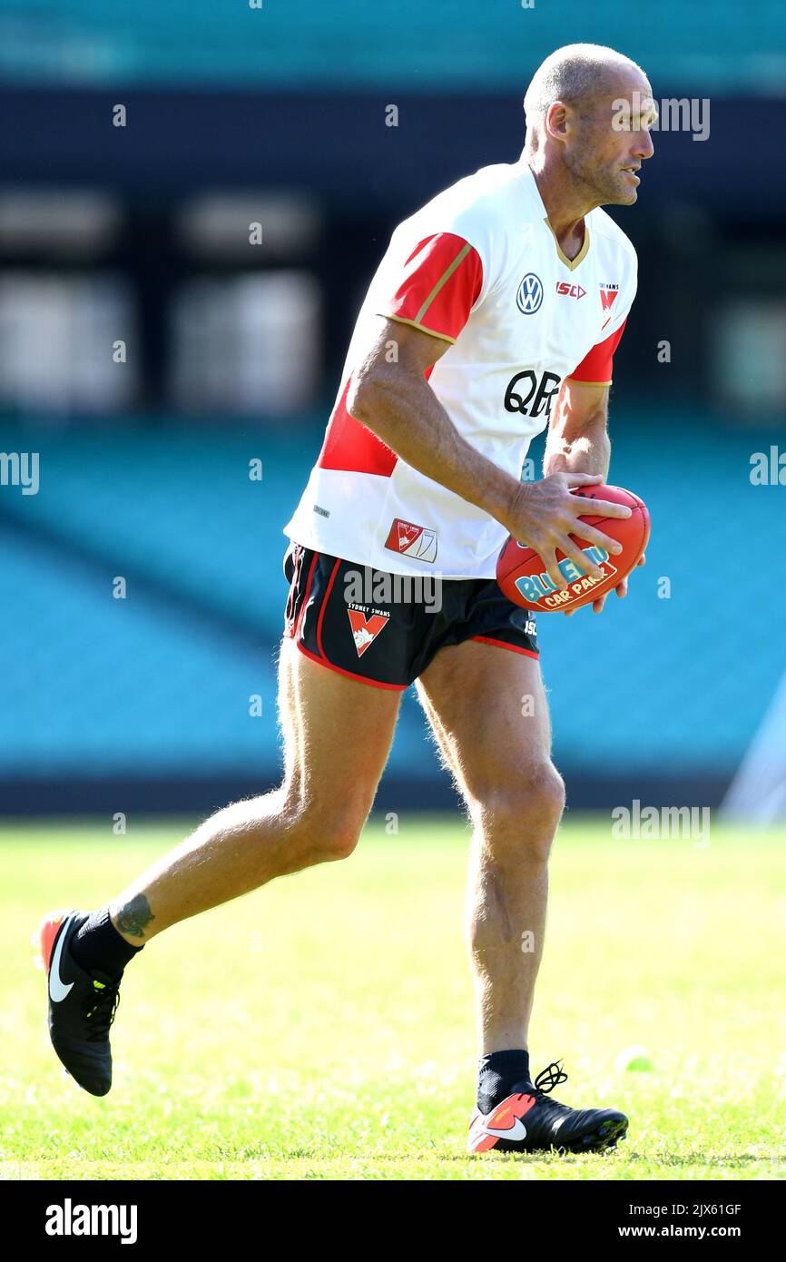 Former Sydney Swans AFL player Tony Lockett assists during a team ...