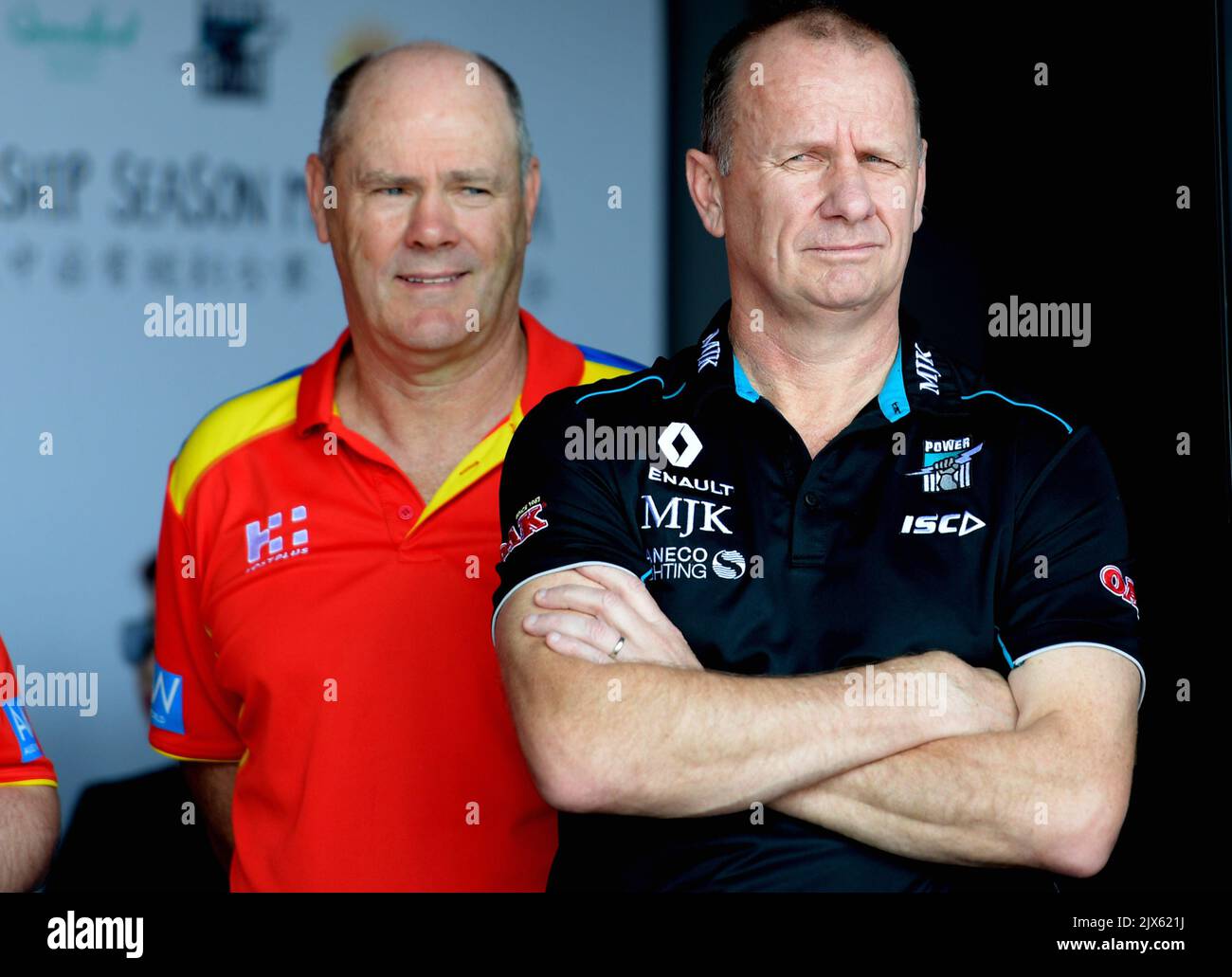 Rodney Eade of the Suns (left) and Coach Ken Hinkley of the Power pose ...