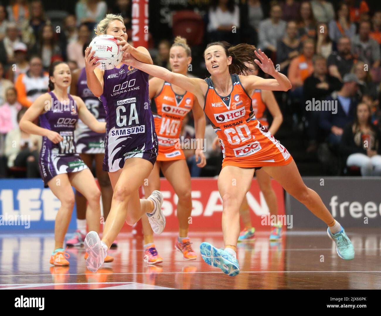 Gretel Tippett of the firebirds and Bec Bulley of the Giants contest ...