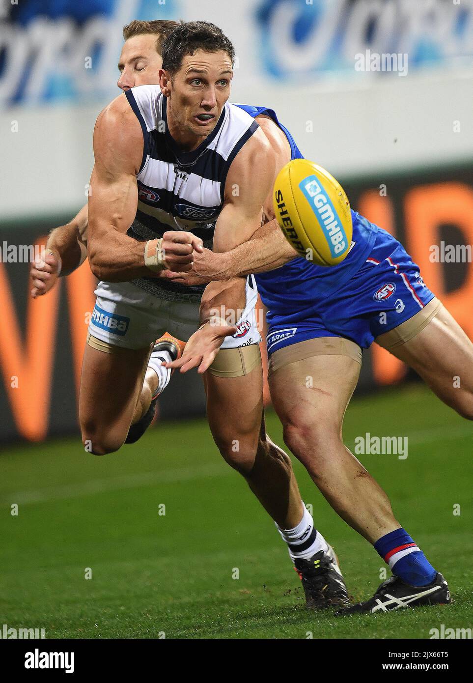 Harry Taylor of the Cats (left) is seen in action during the Round 9 ...