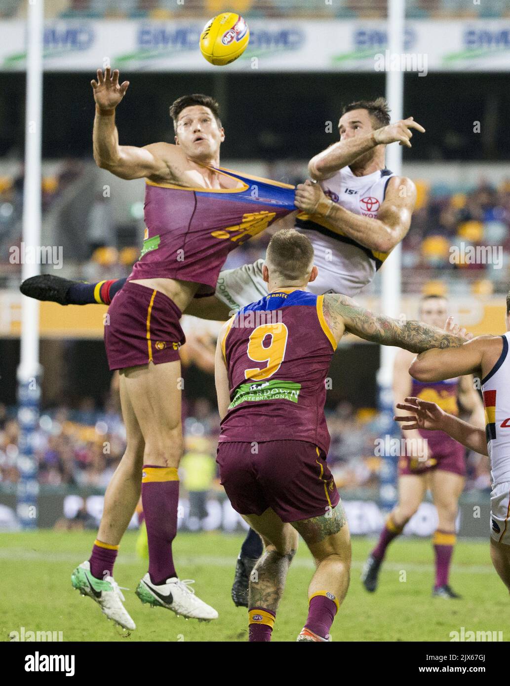 Stefan Martin of the Lions (left) attempts to mark the ball during the ...