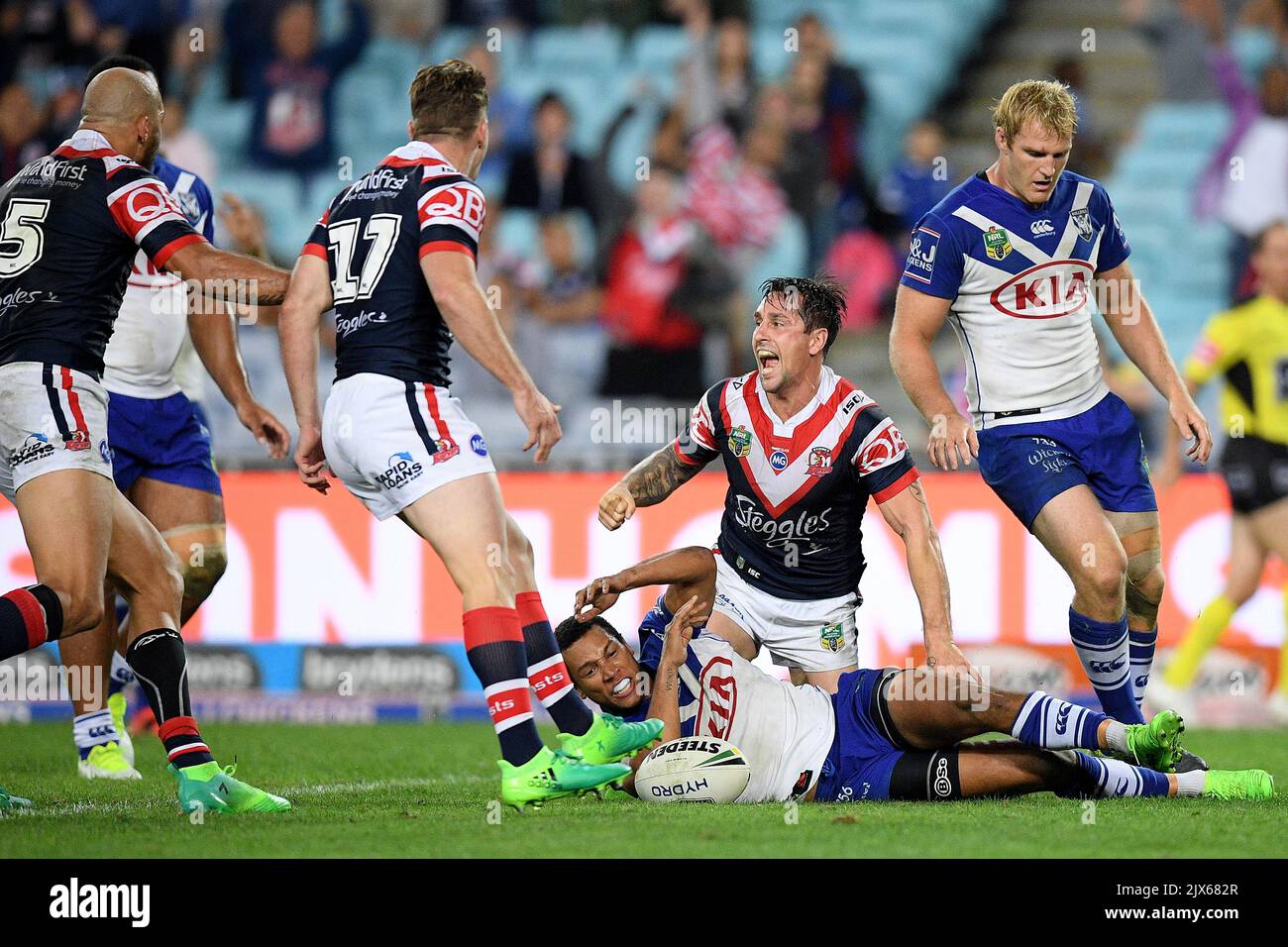 Mitchell Pearce of the Roosters scores a try during the Round 11 NRL ...