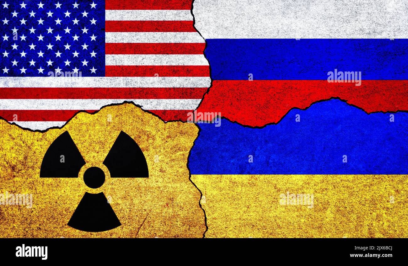 Flags of USA, Russia, Ukraine and radiation symbol on a wall. United ...