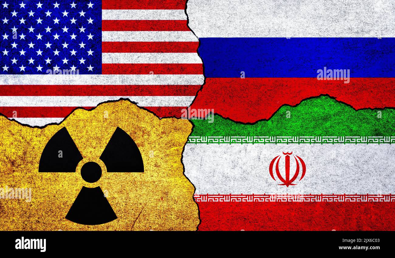 Flags of USA, Russia, Iran and radiation symbol on a wall. United ...