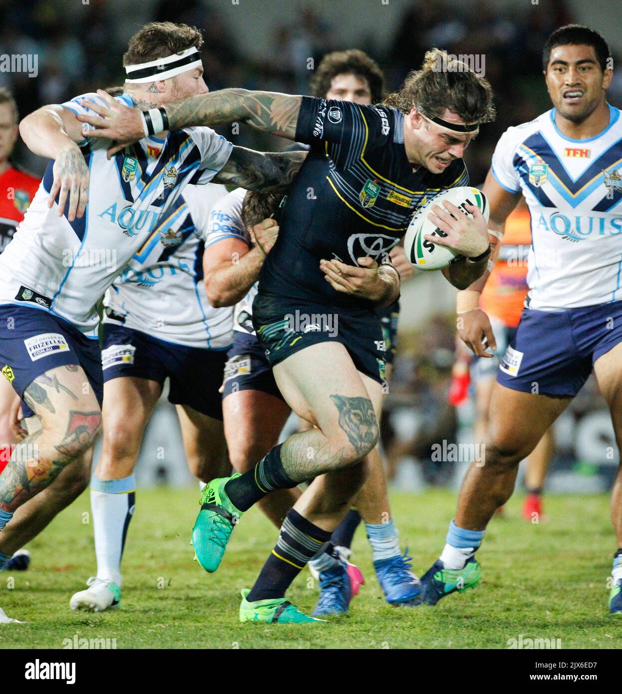 Cowboys Ethan Lowe tackled by Titans defence during the Round 13 NRL ...