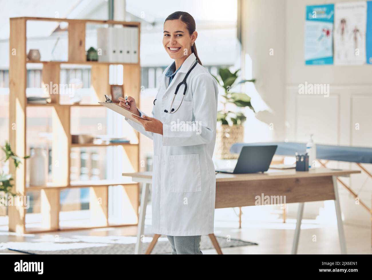 Doctor in an office with a happy portrait for trust, health care ...