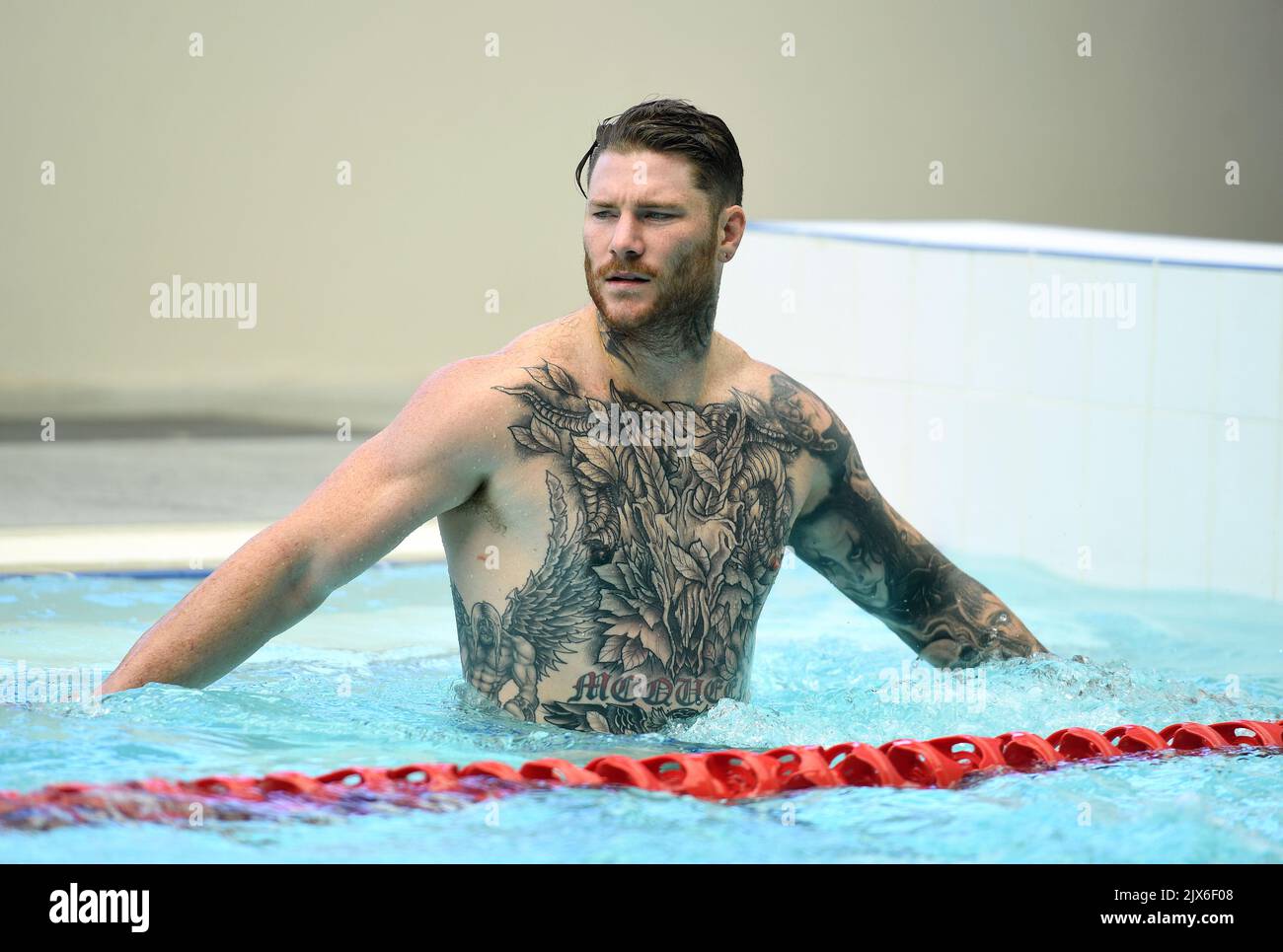 Chris McQueen looks on during the Gold Coast Titans recovery session at ...