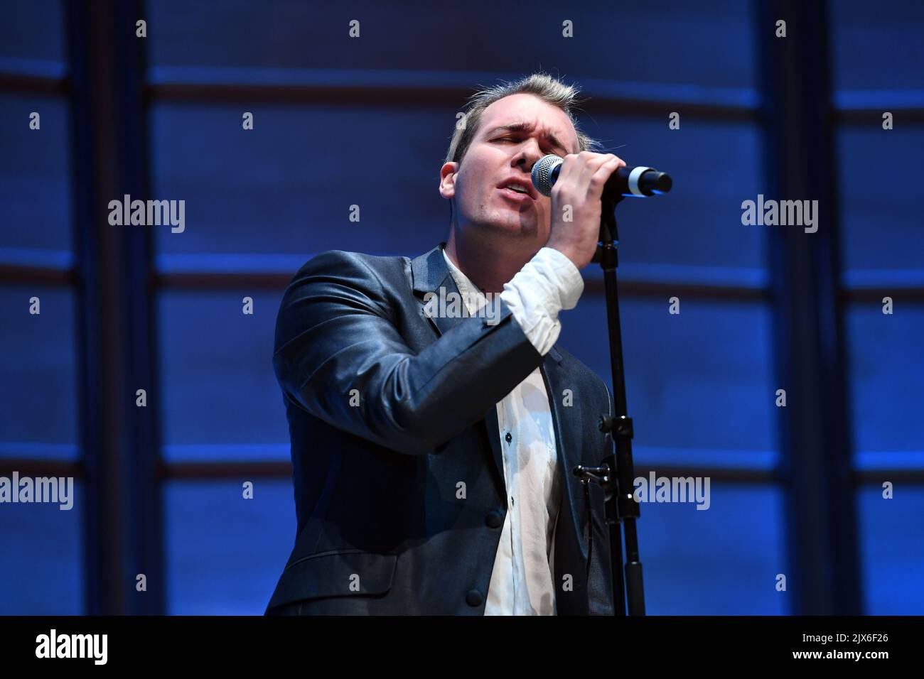 Will Colvin, the son of Mark Colvin, performs a song at a memorial ...
