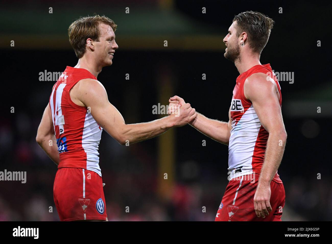 Callum Mills (left) and Harry Marsh of the Swans celebrate their win ...