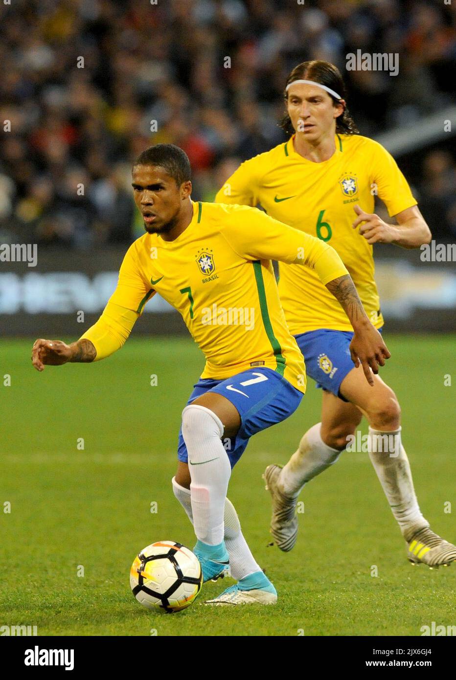 Douglas Souza of Brazil (left) runs with the ball during an ...
