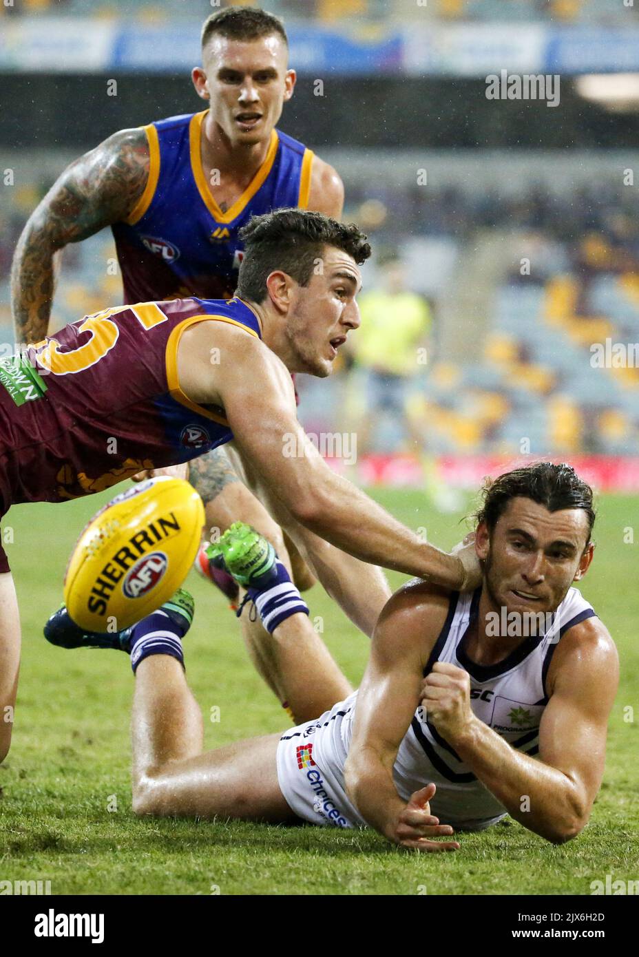 Daniel McStay(left) of the Lions tackles Connor Blackely of the Dockers ...