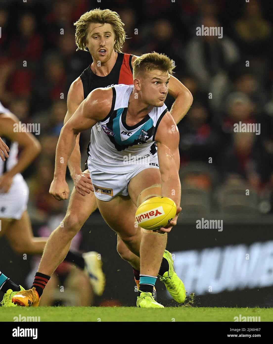 Ollie Wines of the Power (right) and Dyson Heppell of the Bombers ...