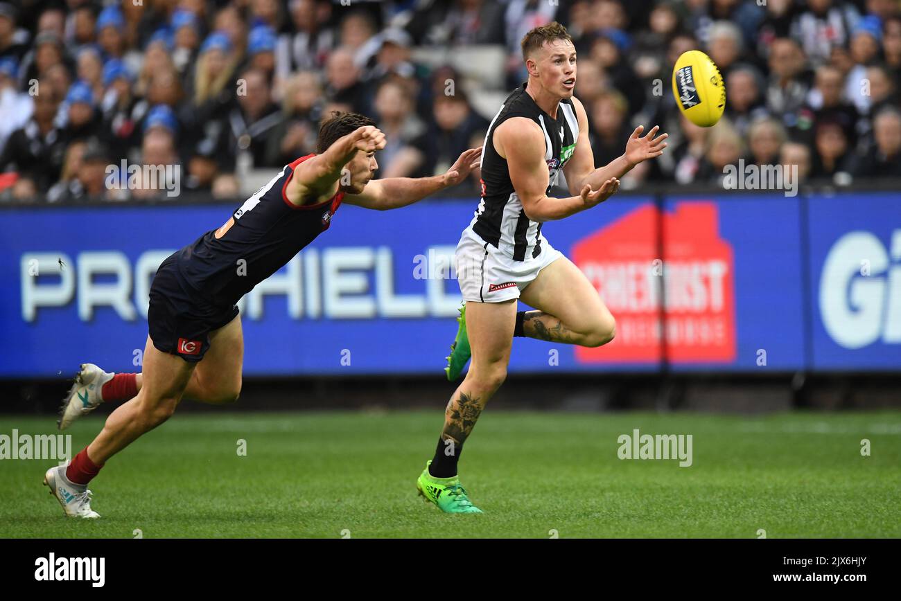 Michael Hibberd of the Demons (left) and Ben Crocker of the Magpies ...