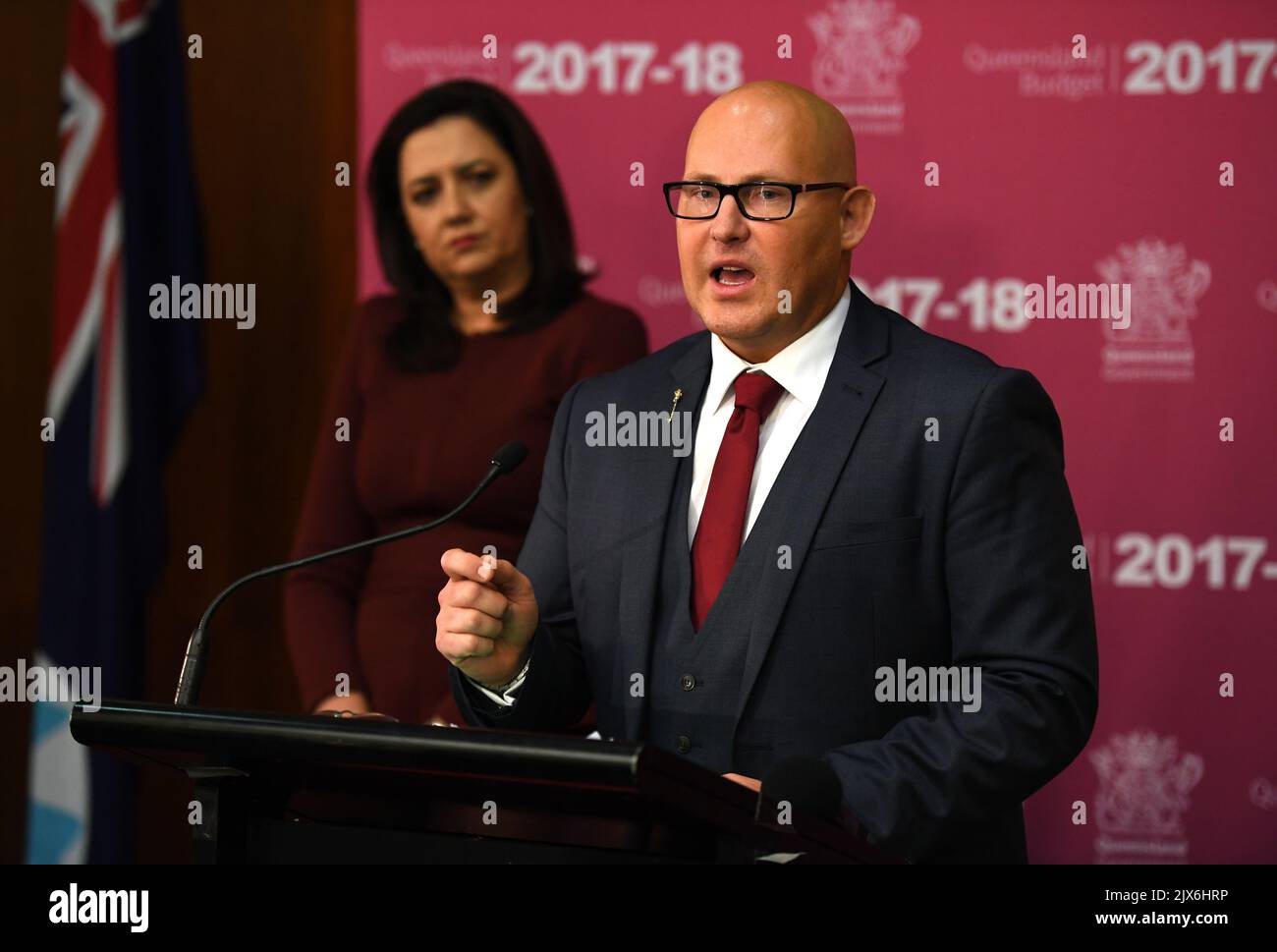 Queensland Treasurer Curtis Pitt, watched by Premier Annastacia ...