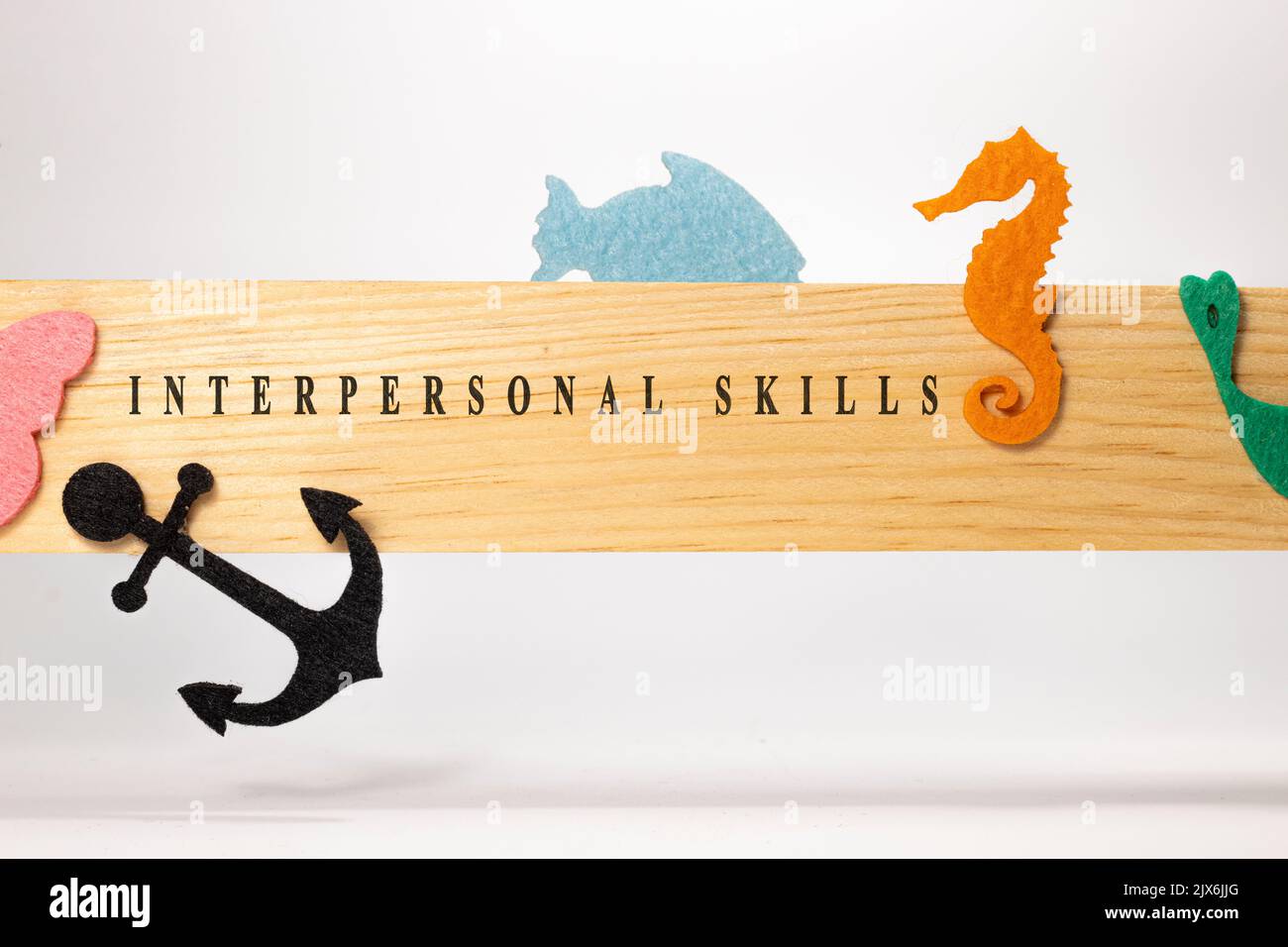 interpersonal skills written on a wooden patterned surface. Education ...
