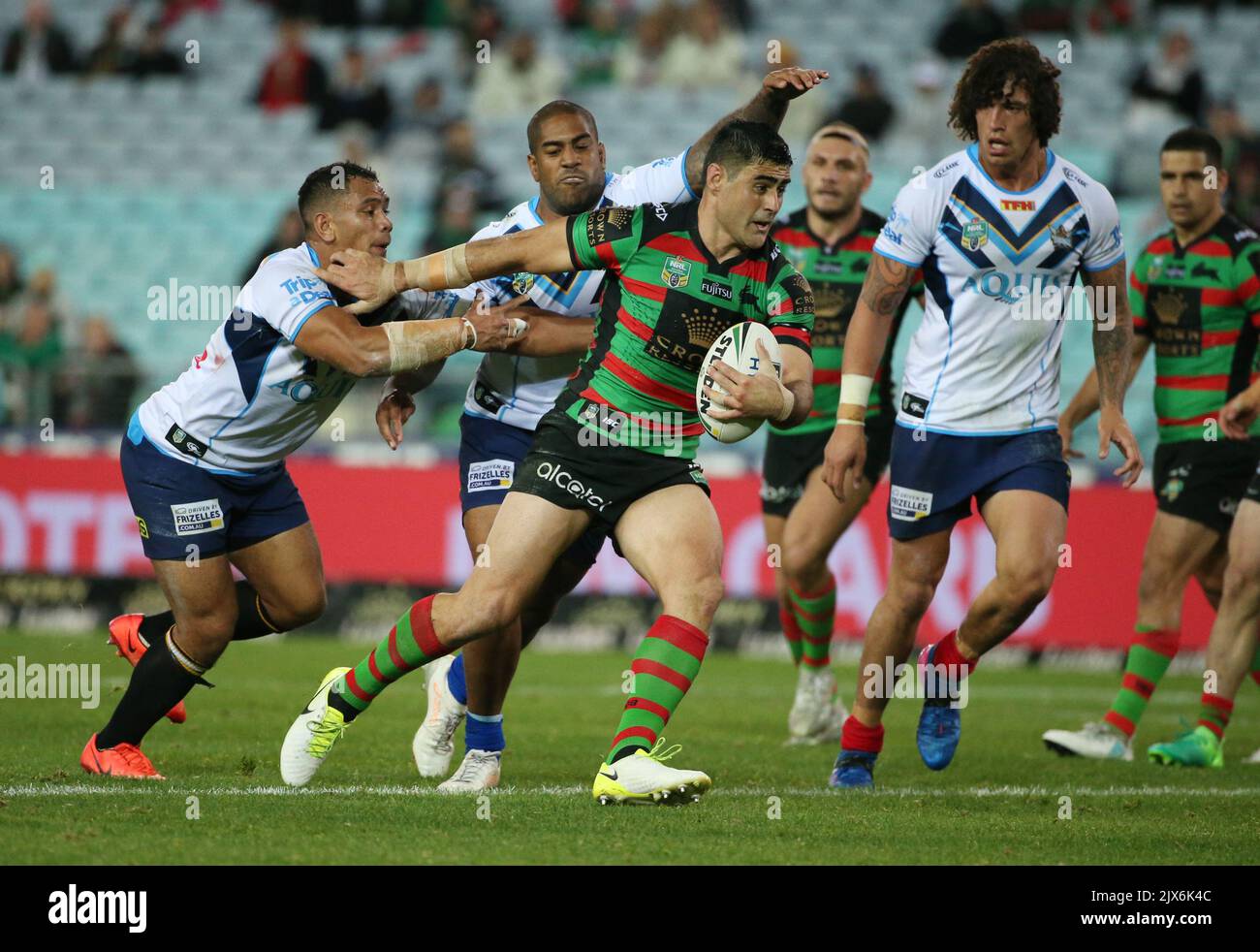 Alex Johnston of the Rabbitohs runs with the ball to score a try during ...