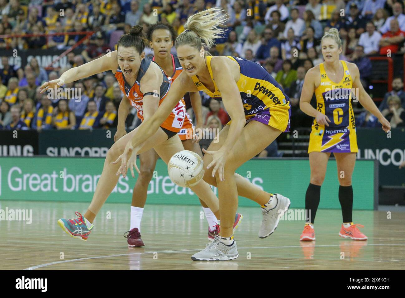 Sam Poolman(left) of the Giants and Caitlin Bassett(right) of the ...