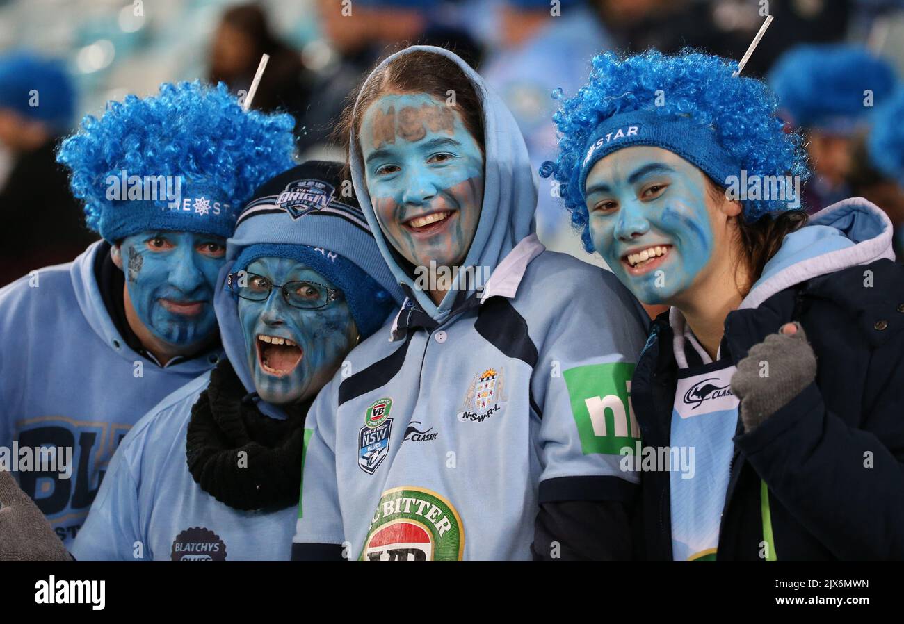 NSW Blues fans pose for a photograph before the State of Origin Game II between the NSW Blues ...