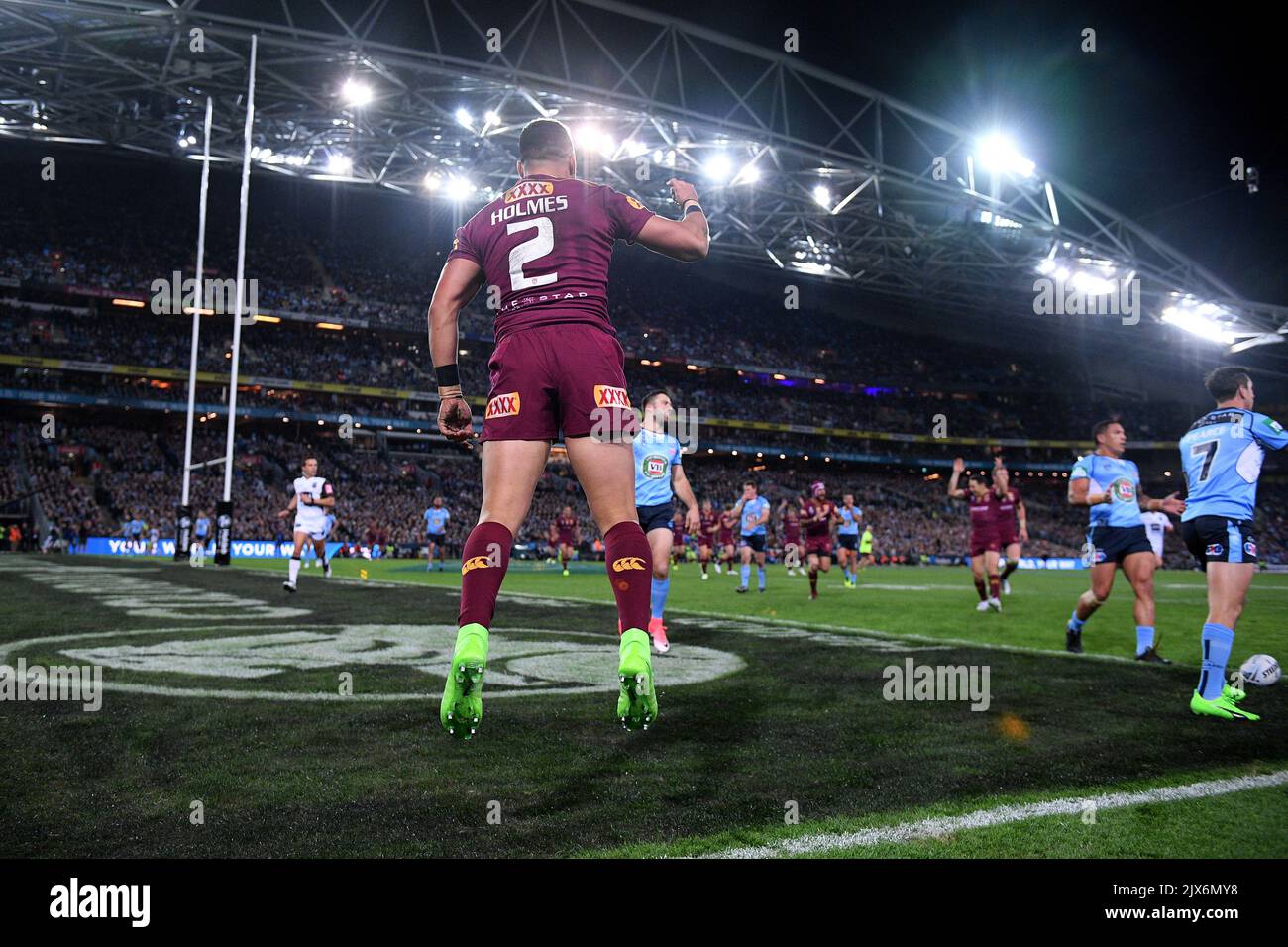 Valentine Holmes of the Maroons, (centre), celebrates after scoring a ...