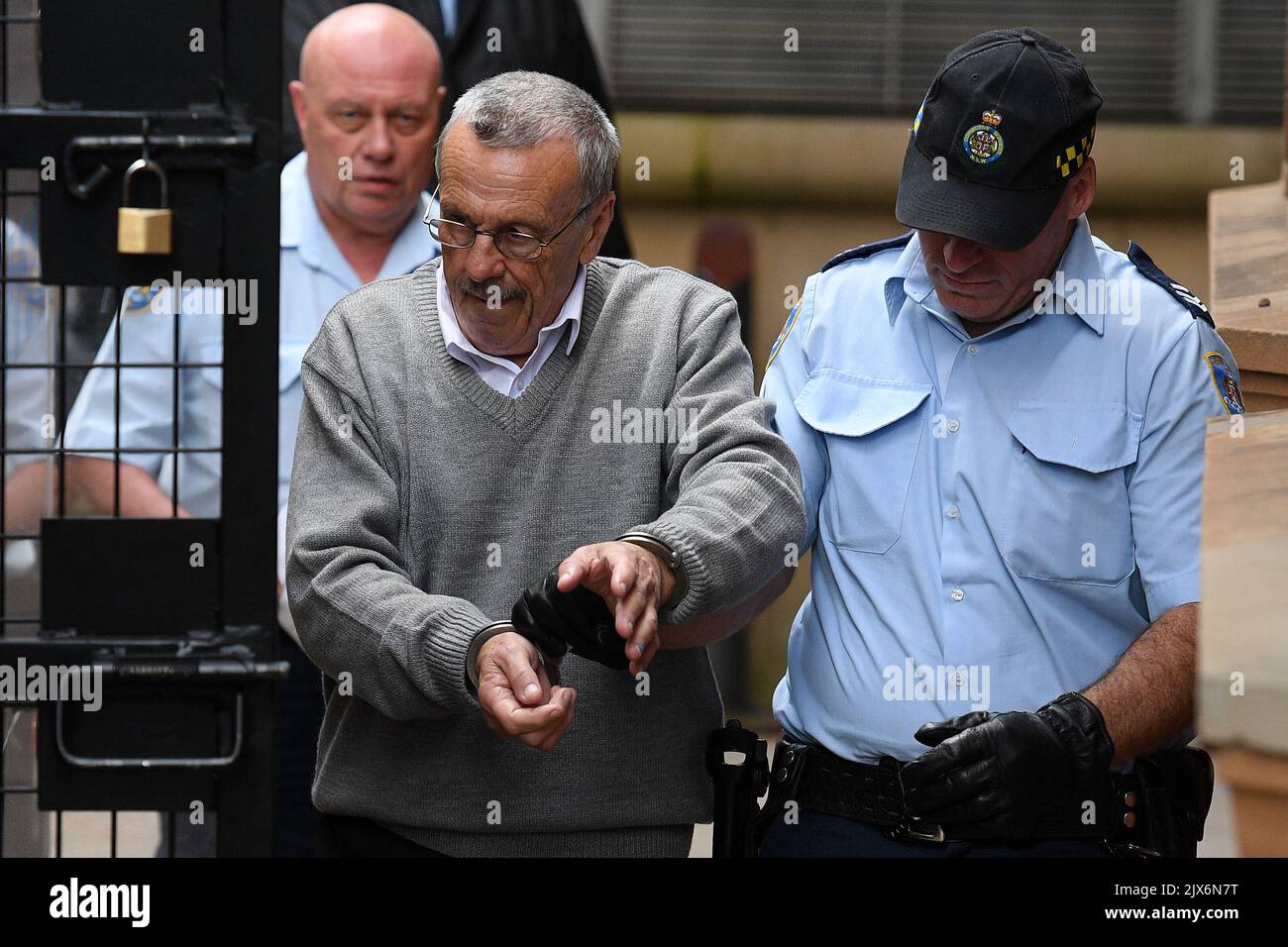 Donald Reeves is escorted by Corrective Services officers to a prison ...