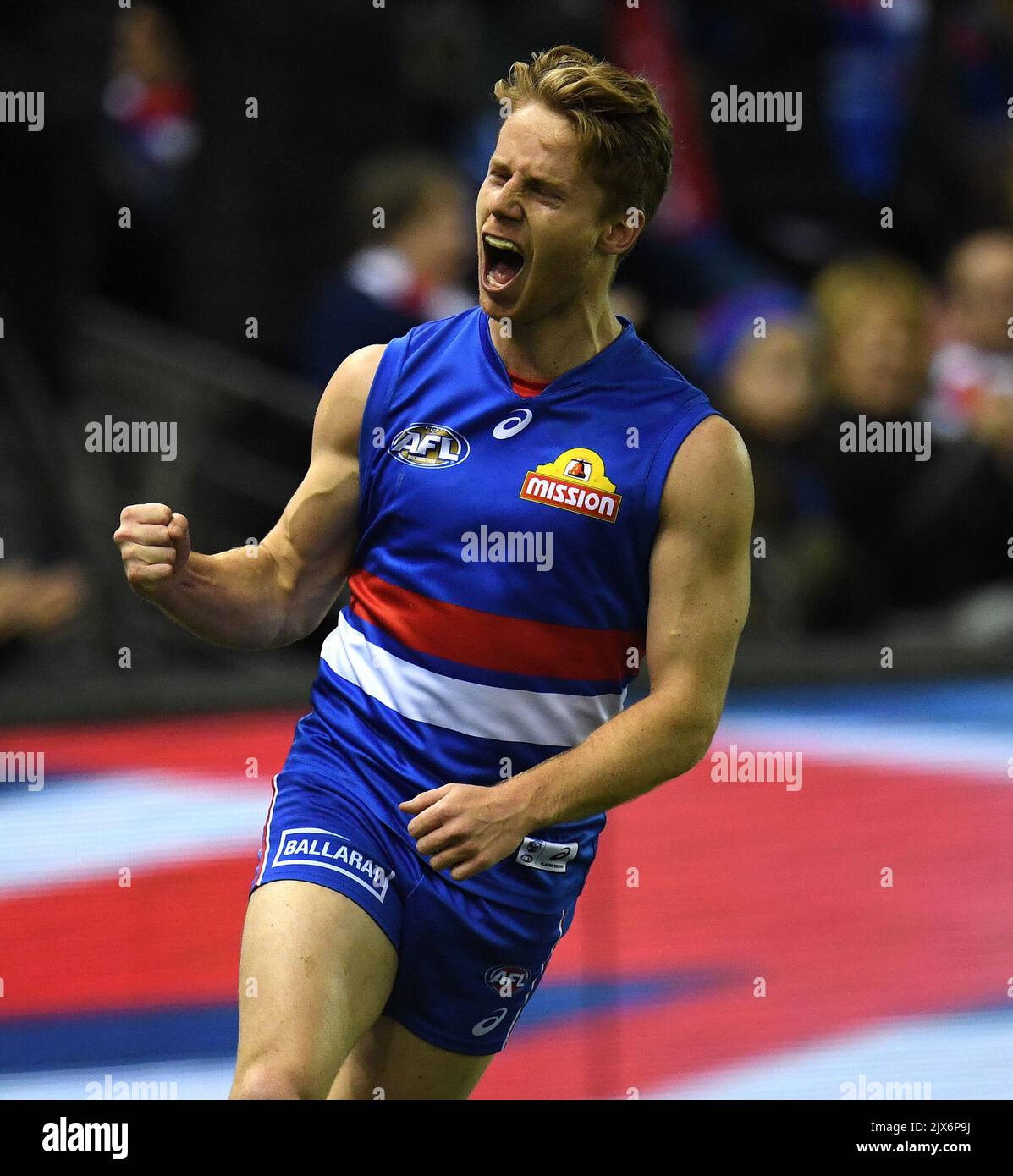Lachie Hunter of the Bulldogs reacts after kicking a goal during the ...