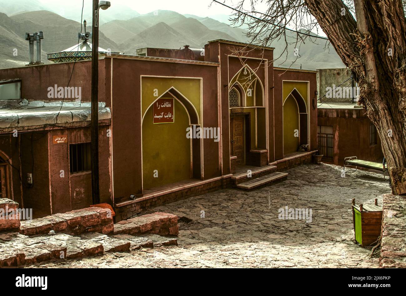 Abyane, Iran, February 17, 2022: A small red clay mosque with a ...