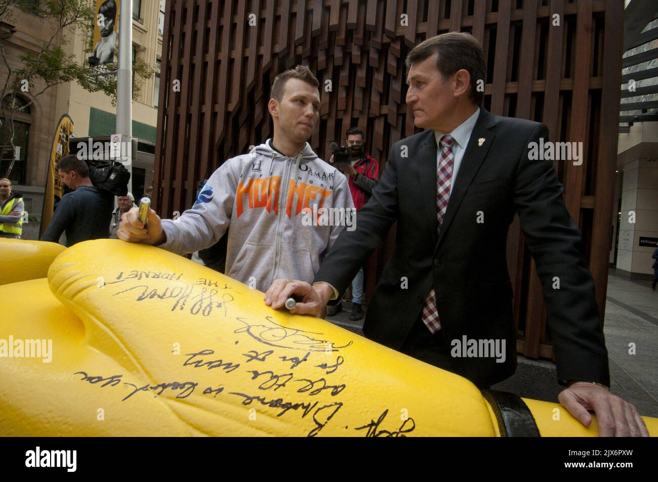 Boxer Jeff Horn (left) with Lord Mayor Graham Quirk during the signing ...