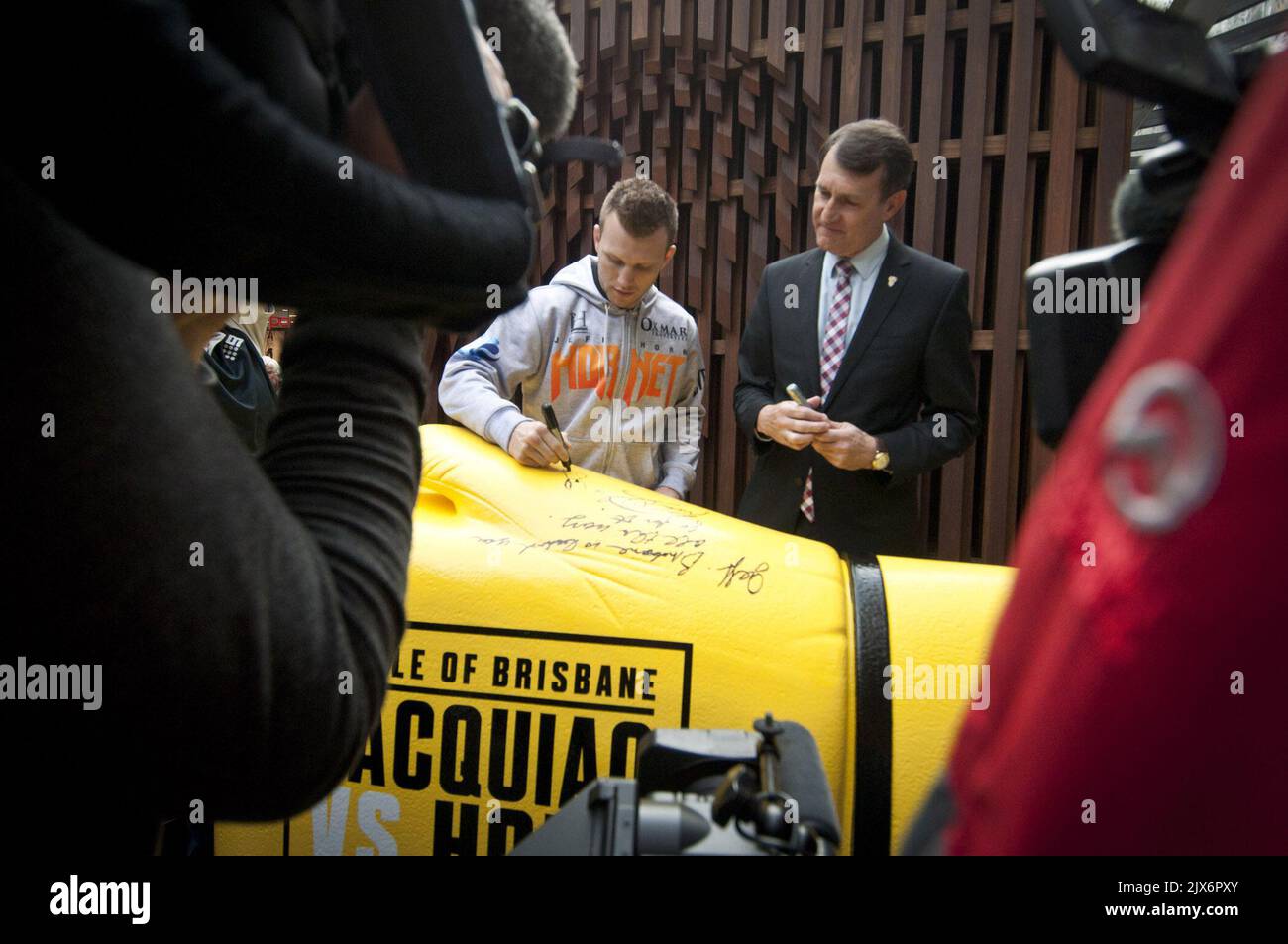 Boxer Jeff Horn (left) with Lord Mayor Graham Quirk during the signing ...