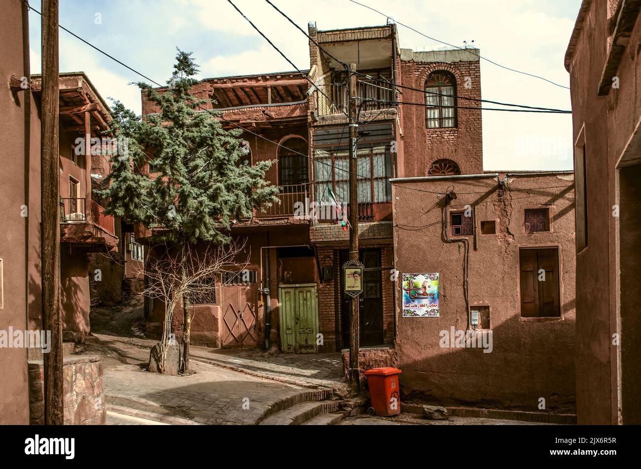 Abyaneh, Iran, February 17, 2022:Three-story brick house with balconies ...