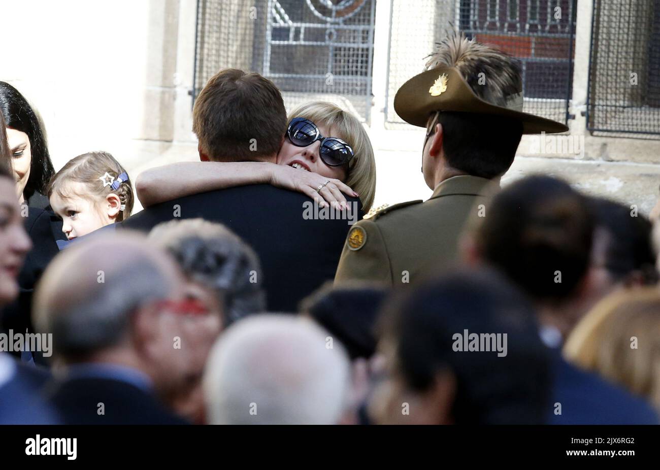 Karen Sciacca, wife of Con Sciacca is greeted by people who attended ...