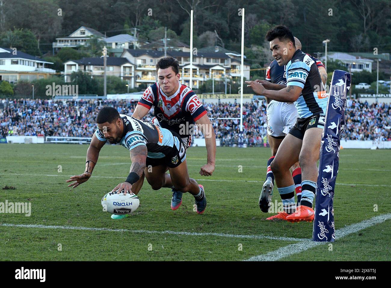 Ricky Leutele of the Sharks scores a try during the Round 17 NRL match ...