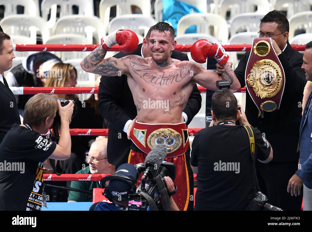 Australia's Damien Hooper (right) celebrates winning his WBO and IBO ...